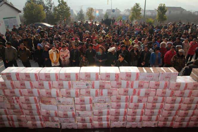 China farmers build wall of cash with $2.2 mn payout: report | World News