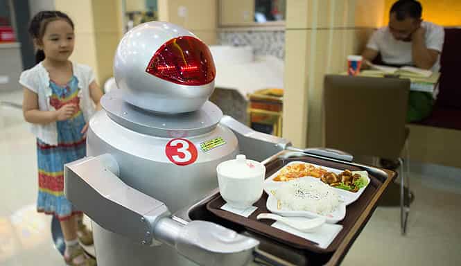 Robots cook food and deliver dishes in this restaurant in China | World ...