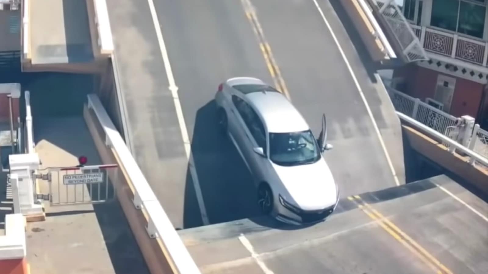 Watch: Honda Accord sedan gets stuck on drawbridge, escapes being ...