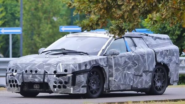 Ferrari EV test mule goes shy, hides design under fake body panels ...
