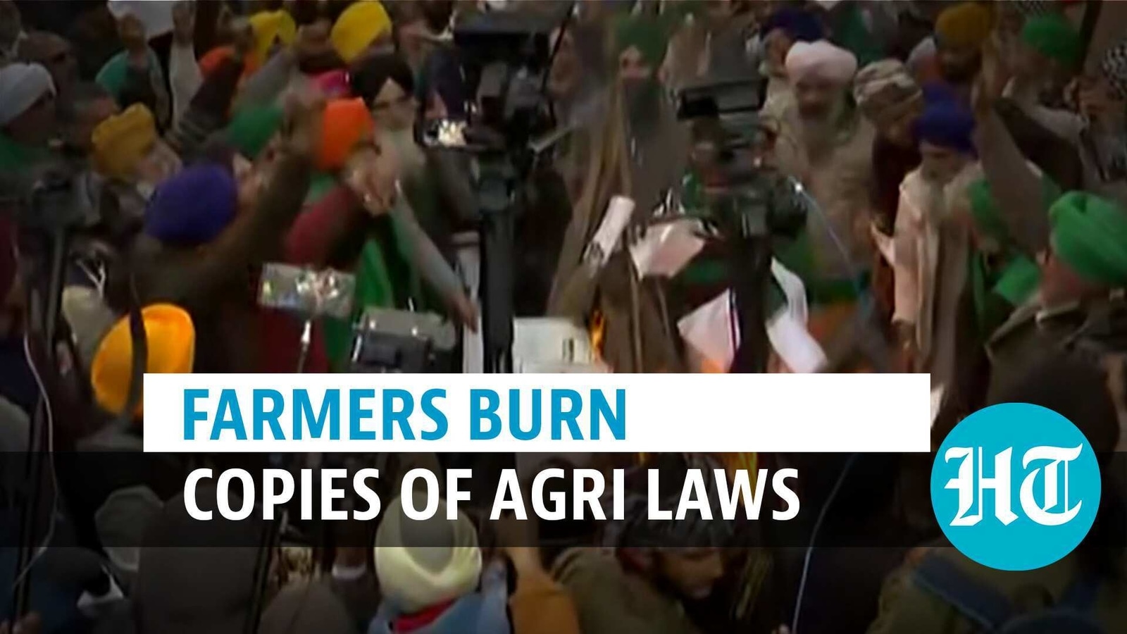 Watch: Protesting farmers burn copies of farm laws on Lohri | Hindustan ...