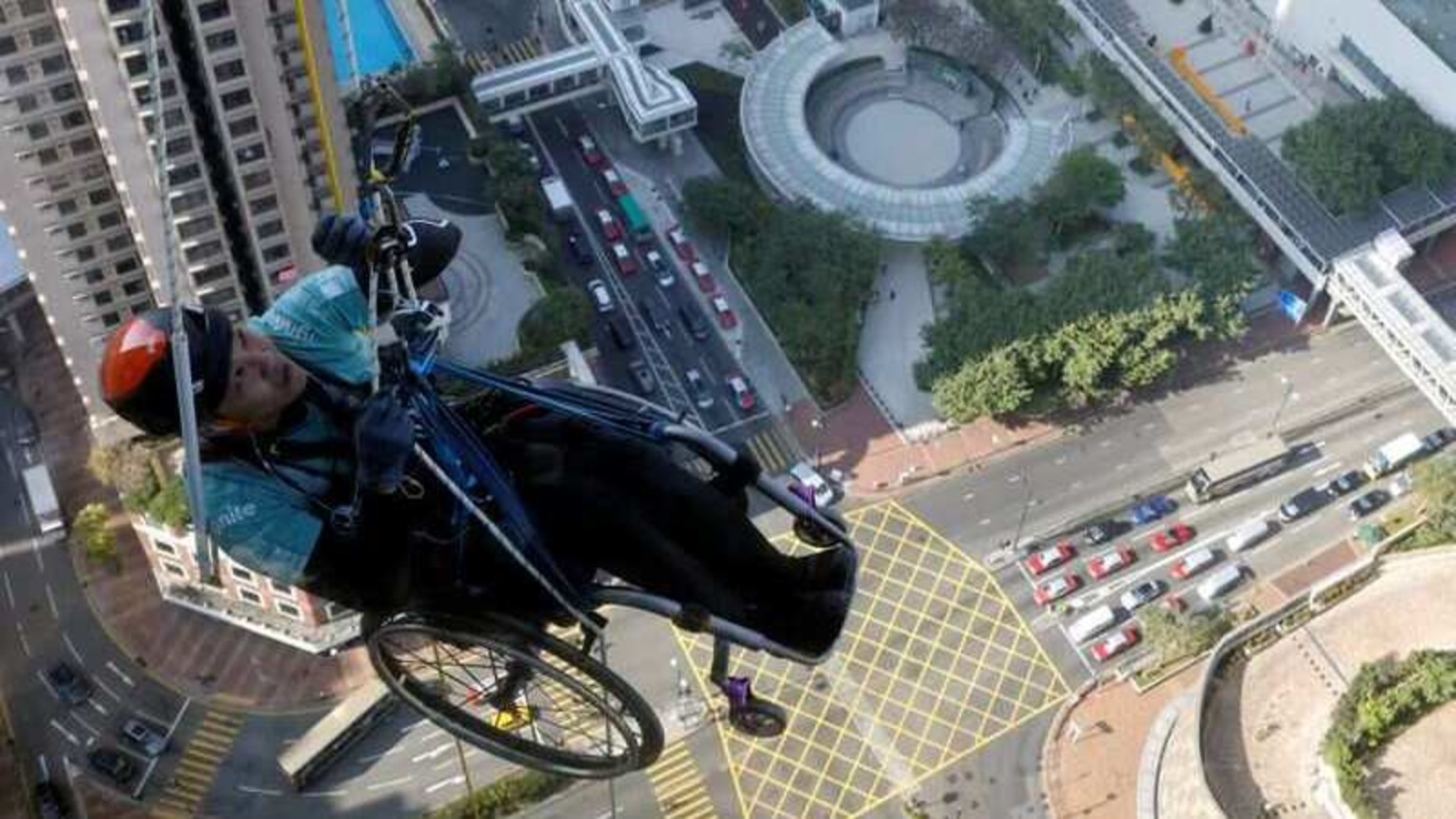 Paraplegic climbs up skyscraper using wheelchair in Hong Kong for this ...