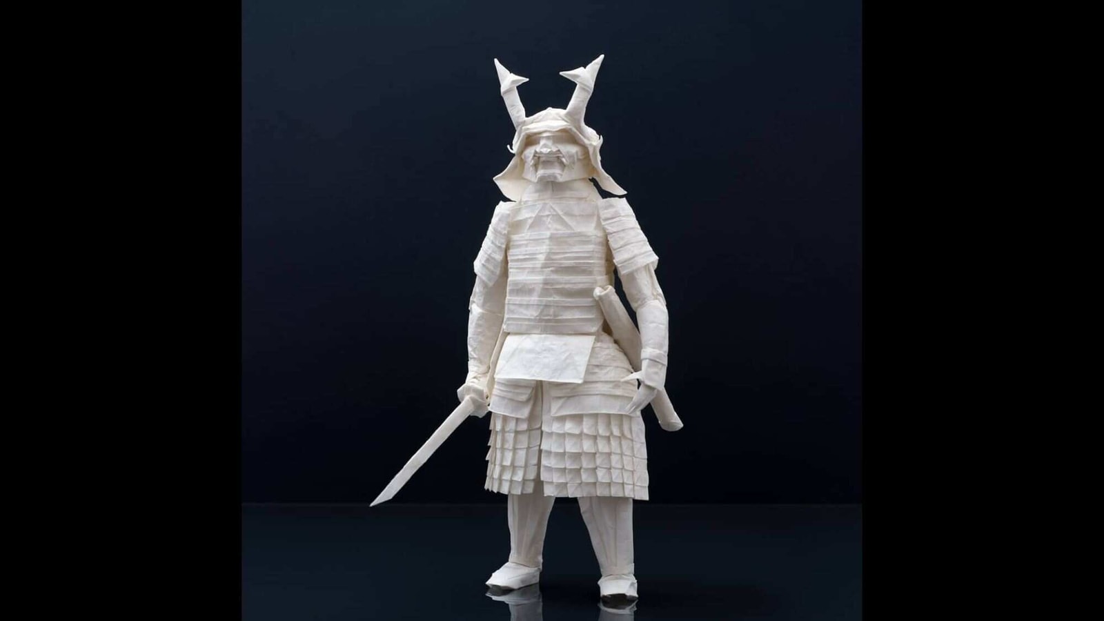 Artist creates intricate origami samurai figure from a single paper ...