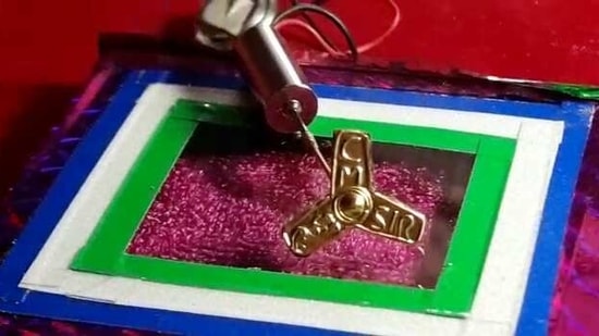 Artist in Andhra creates miniature golden YSRCP symbol on party's ...