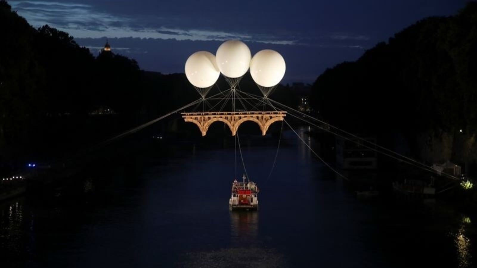French artist installs Michelangelo-inspired bridge above Rome's Tiber ...