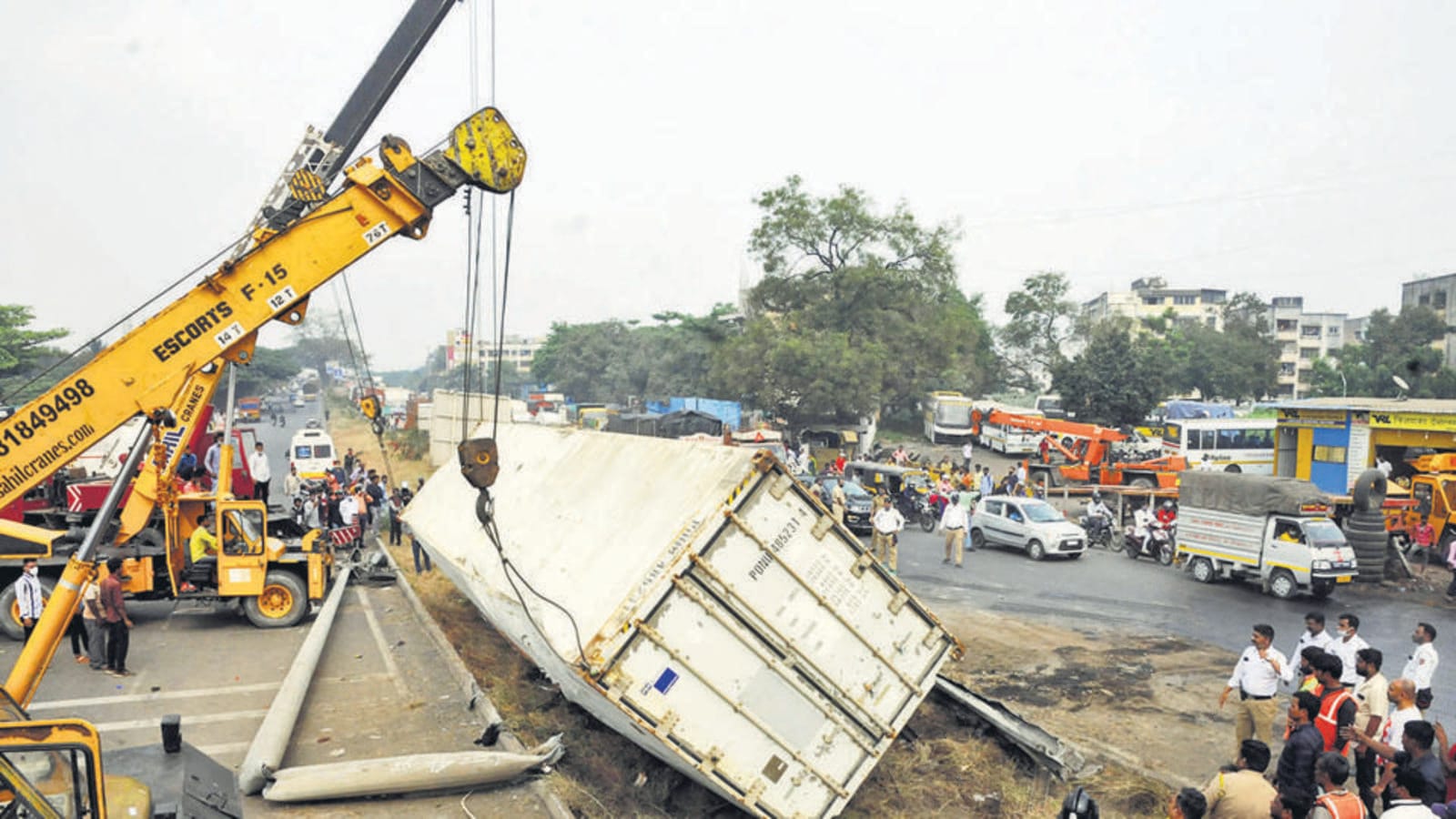 Truck flips on side at Navale bridge chowk in Pune causing major ...