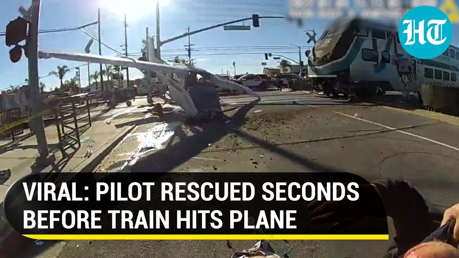 Watch: Pilot rescued seconds before train hits plane, video goes viral ...