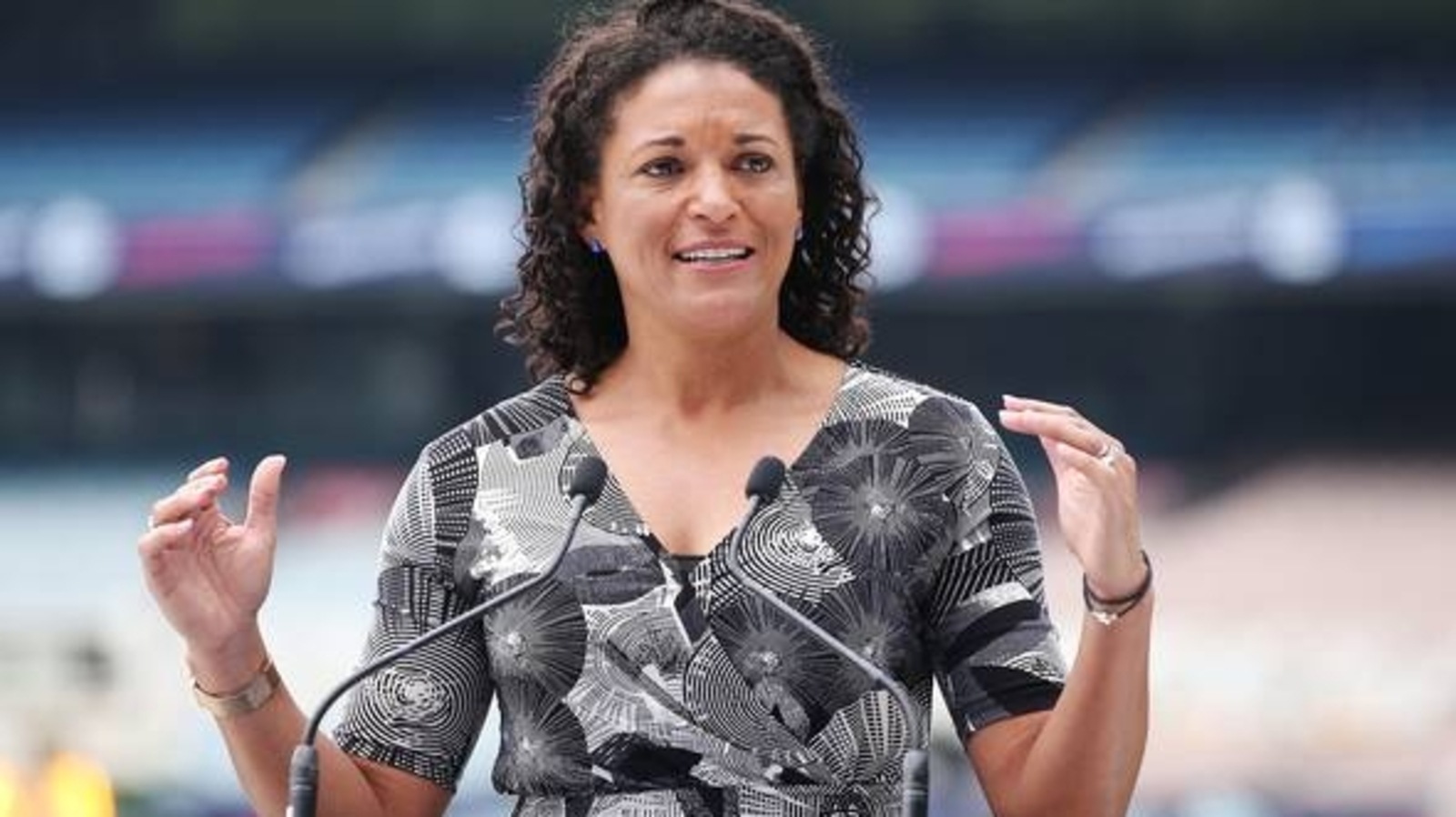 Mel Jones gifts bat to kids playing cricket with a bottle in stands ...