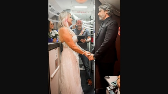 This couple got married on a flight. The spontaneous backstory will ...
