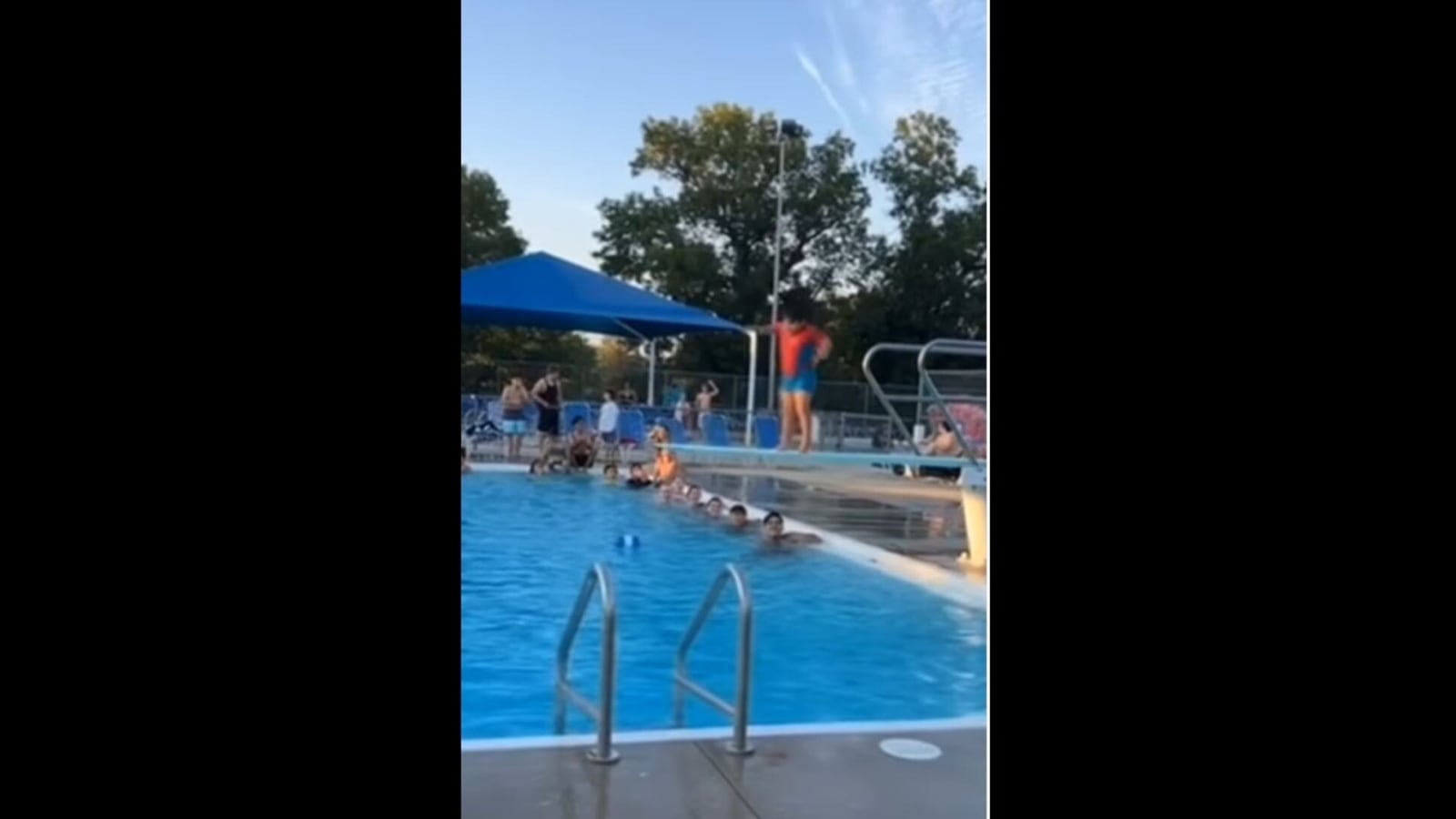 Crowd cheers for little boy wearing Spider-Man costume as he dives in ...