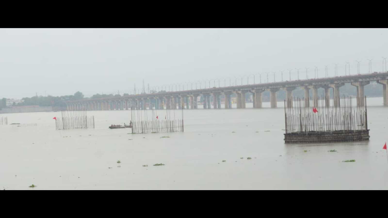Pillars of under-construction railway bridge go under water in ...