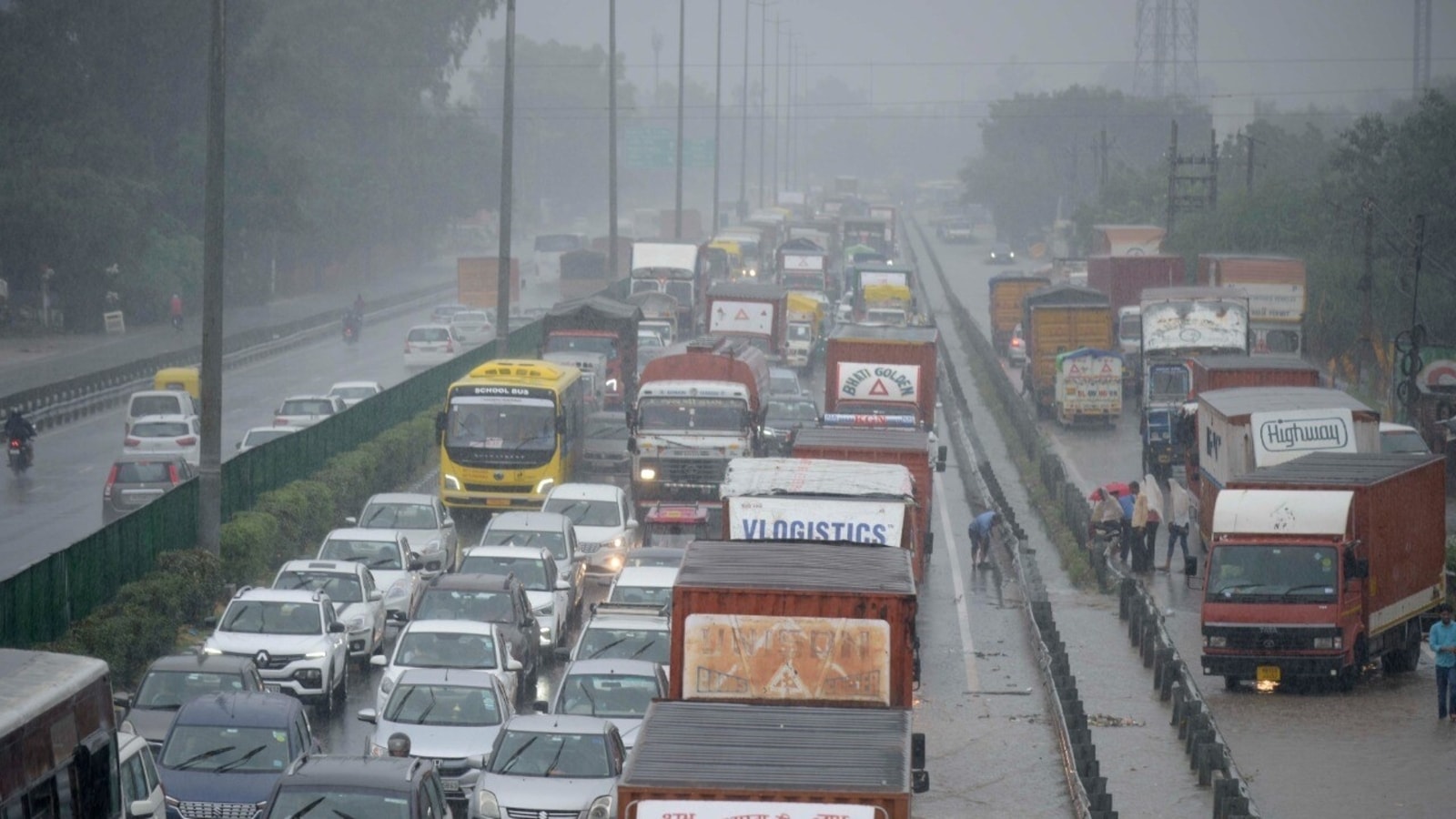 Delhi rain aftermath: Videos show commuters struggling on waterlogged ...