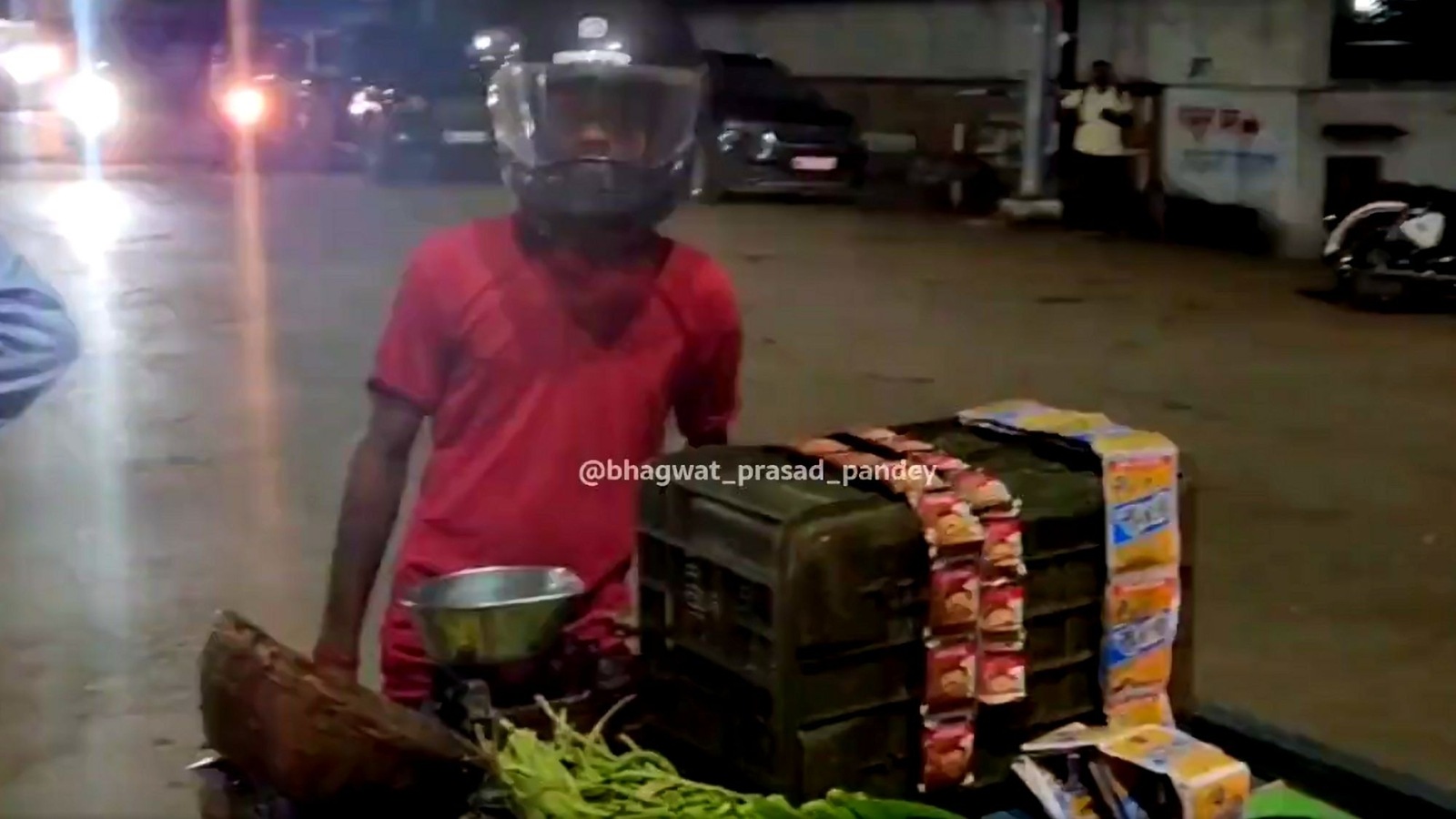 Vegetable vendor wears helmet while pushing his cart to avoid challan ...
