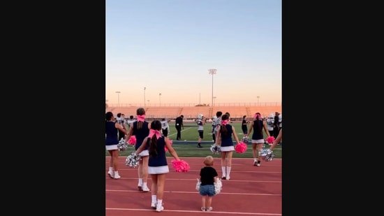 Two-year-old boy imitates cheerleaders while holding pom poms, video ...
