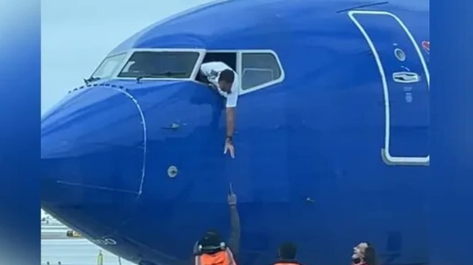 Watch: Before take-off airline captain hangs from window for passenger ...