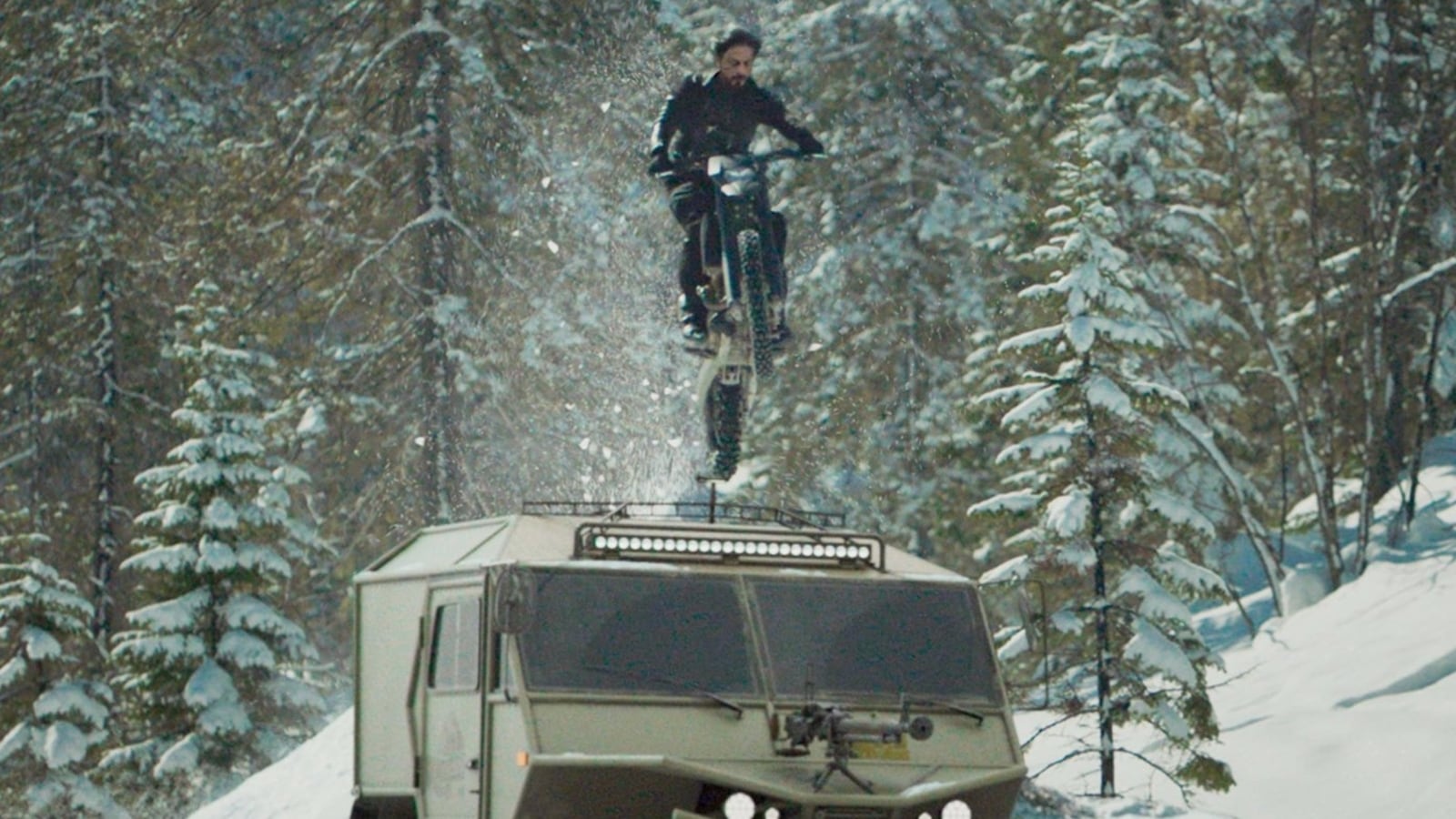 New Pathaan stills show Shah Rukh Khan riding motorcycle and flying ...