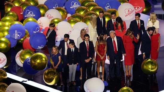 Melania seals Donald Trump's RNC nomination speech with a kiss, Baron ...