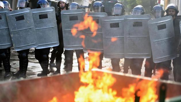 Activist killed in police raid during riots over Paraguay re-election ...