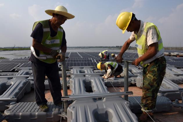 PHOTOS: China turns on the world’s largest floating solar farm ...