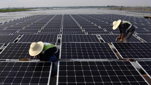 PHOTOS: China turns on the world’s largest floating solar farm ...