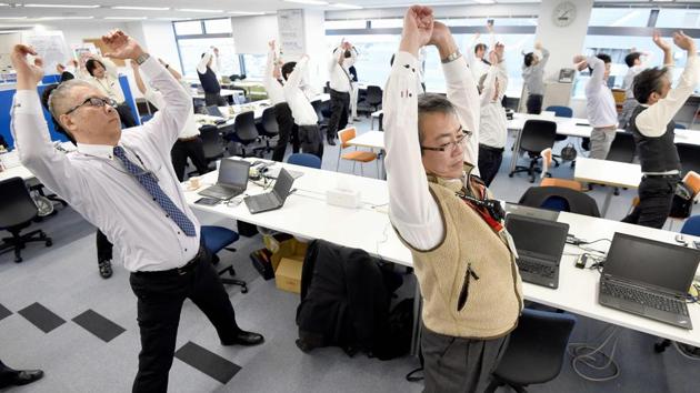Work well, live well: Japanese office goers limber up with monkey bars ...