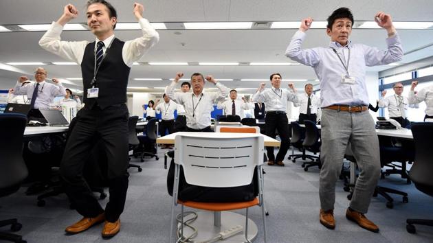 Work well, live well: Japanese office goers limber up with monkey bars ...