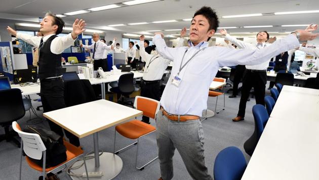 Work well, live well: Japanese office goers limber up with monkey bars ...