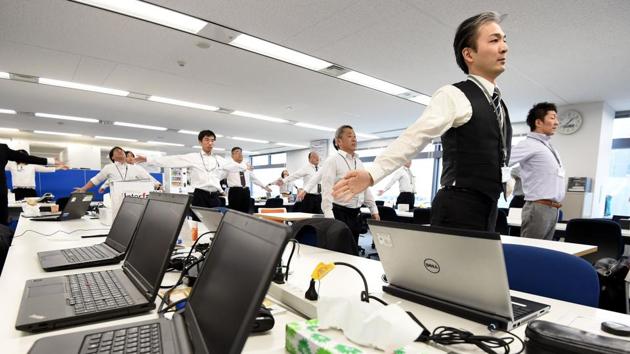 Work well, live well: Japanese office goers limber up with monkey bars ...