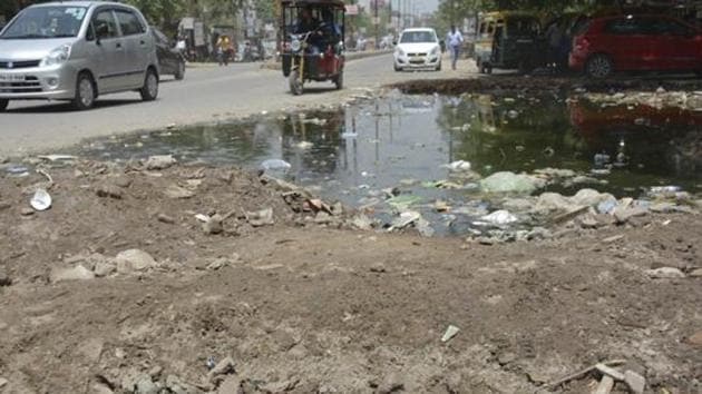 Potholes puncture Delhi roads, make commuting a nightmare | Latest News ...