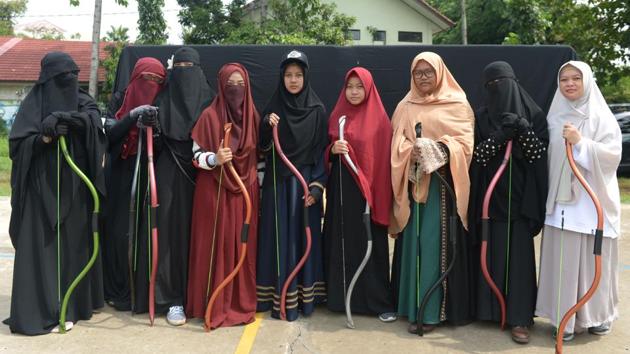 Photos: Indonesian women’s ‘Niqab Squad’ fights face veil prejudice ...