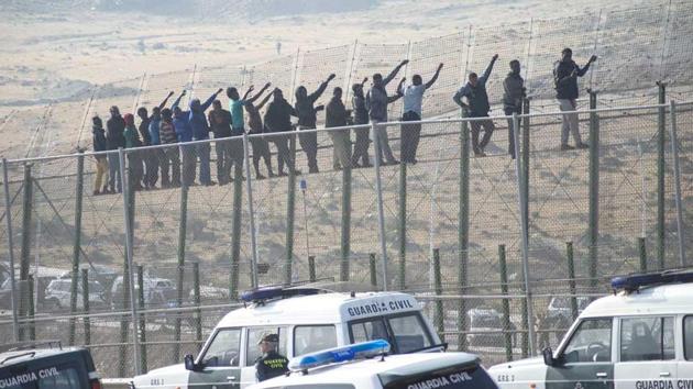 200 migrants reach Spain after storming fence | World News