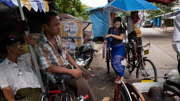 Photos: Myanmar’s iconic trishaws unfazed by cars, clogged roads ...