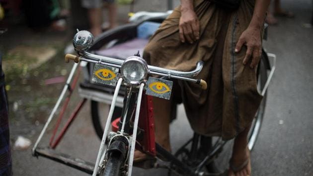 Photos: Myanmar’s iconic trishaws unfazed by cars, clogged roads ...