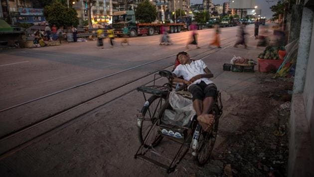 Photos: Myanmar’s iconic trishaws unfazed by cars, clogged roads ...