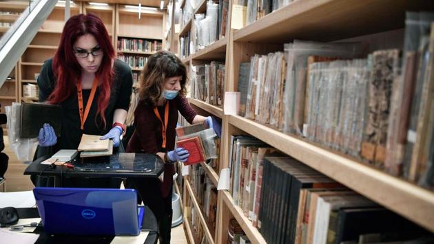 Photos: At 100, Greece library makes a historic trip to Athens ...