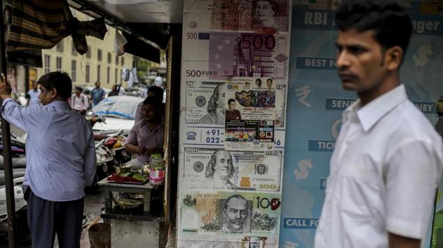 Photos: Indian rupee’s fall breaks record low as trade war intensifies ...