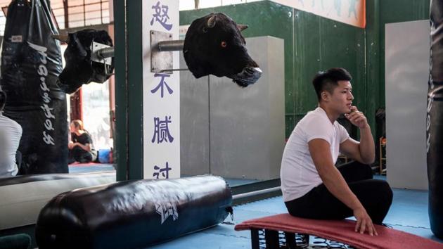 Photos: Chinese martial artists lock horns with bulls in wrestling ...