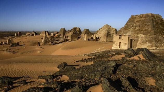 Lighting above Kuwait City and a tightrope walker in Prague: Photos of ...