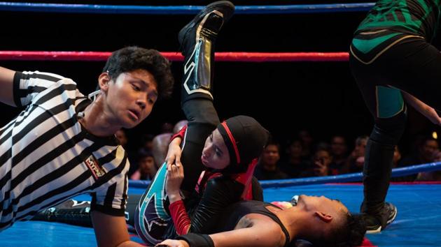 Photos: A hijab-wearing wrestler breaks barriers in Malaysia ...
