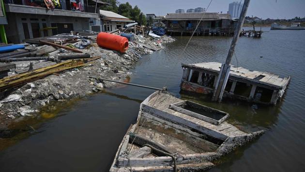Photos | Sinking city: Indonesia’s capital on brink of disaster ...
