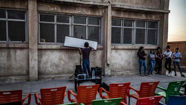 Photos: Roving cinema brings movie magic to Syria’s Kurdish children ...