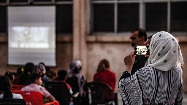 Photos: Roving cinema brings movie magic to Syria’s Kurdish children ...