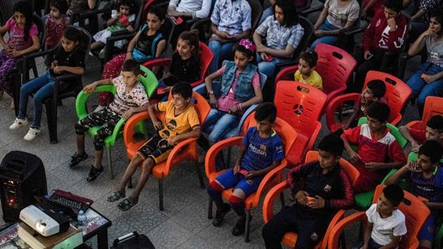Photos: Roving cinema brings movie magic to Syria’s Kurdish children ...