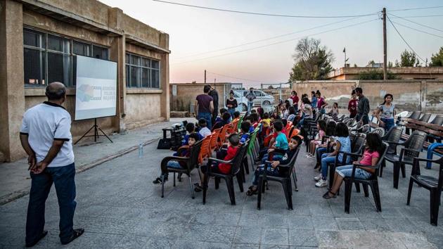 Photos: Roving cinema brings movie magic to Syria’s Kurdish children ...