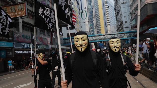 Hong Kong police fire tear gas at protesters in shopping district ...