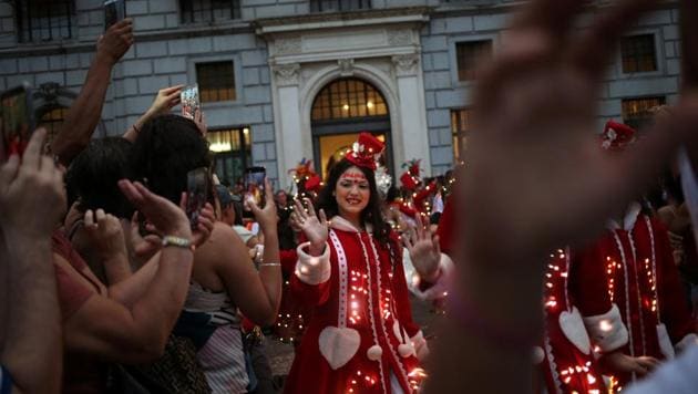 PHOTOS | Merry Christmas 2019: Costumed folk walk the streets of Brazil ...