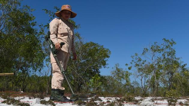 Photos: Vietnamese women clear countryside of war-era mines | Hindustan ...