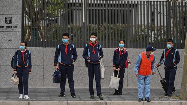 Photos: Students back to school in China, as restrictions ease ...