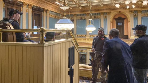 Covid-19: Armed US protesters enter Michigan capitol, demand lockdown ...