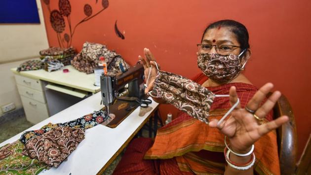 Photos: Mother-son duo provide free masks in Delhi’s CR Park ...